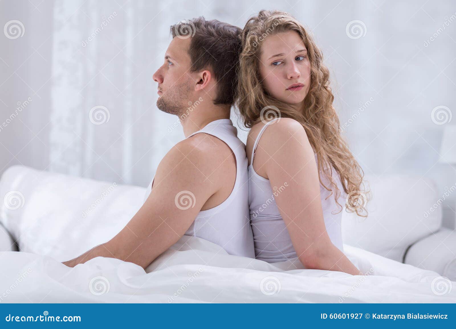 Couple Sitting Back To Back Stock Image - Image of attractive, sitting ...