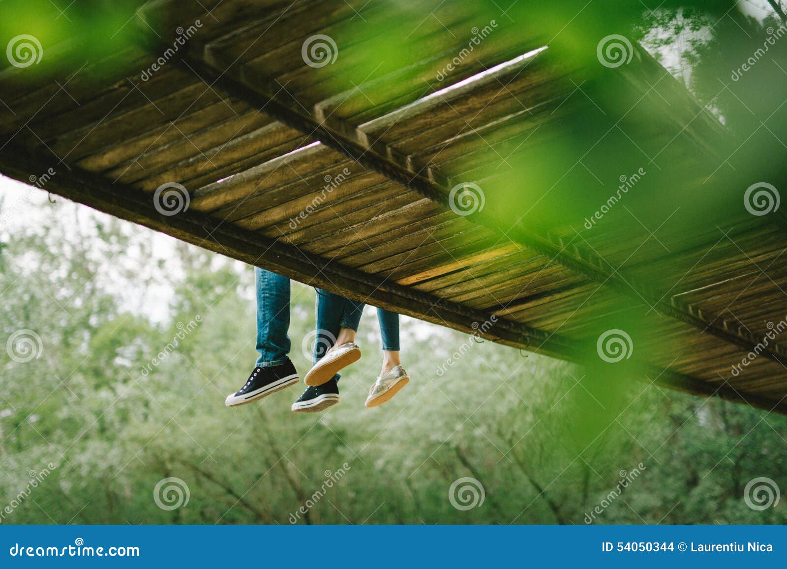 Couple Sitting on the Bridge Stock Photo - Image of family, bridge ...