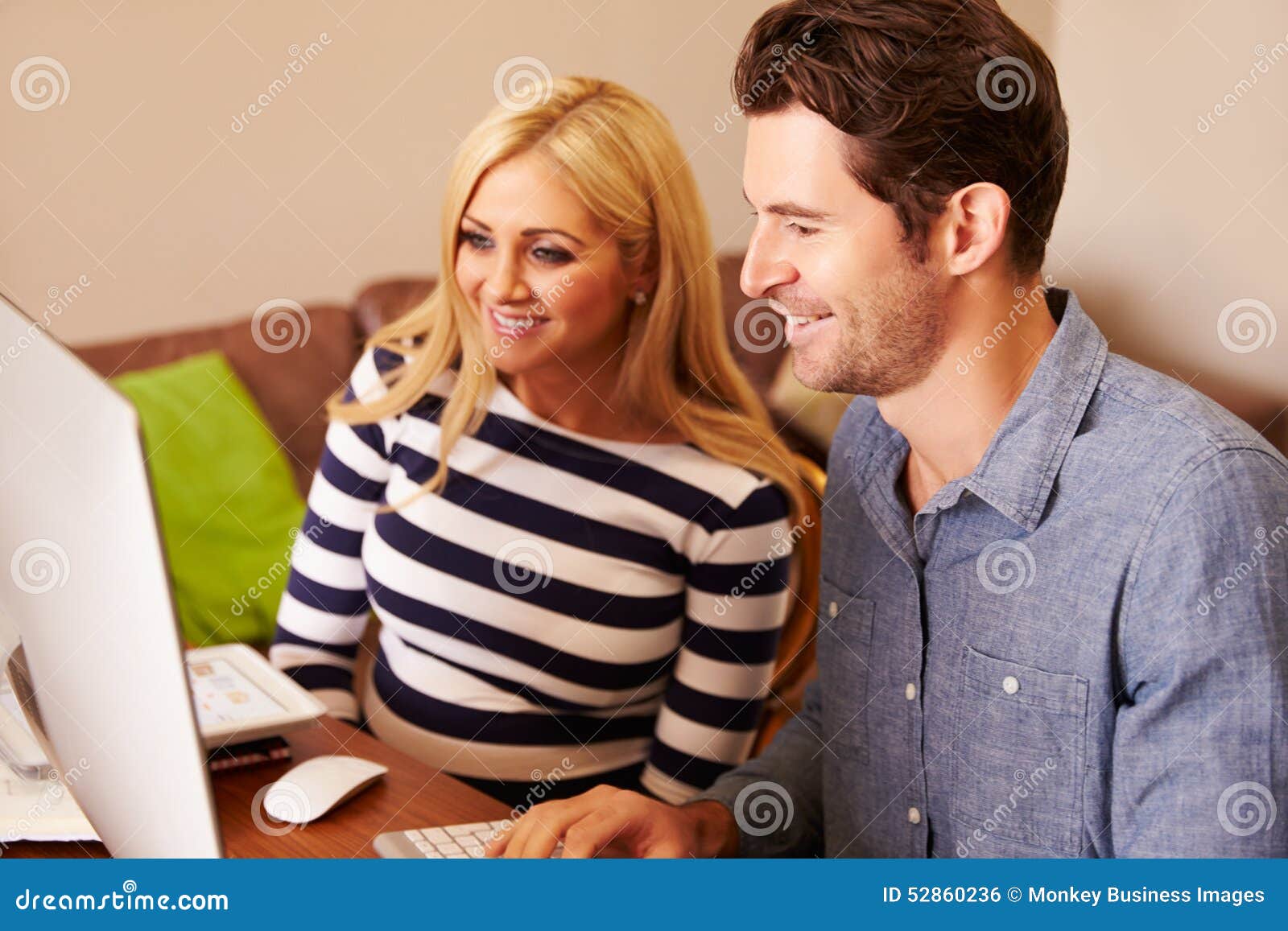 Couple Sitting at Computer in Home Office Shopping on Line Stock Photo ...