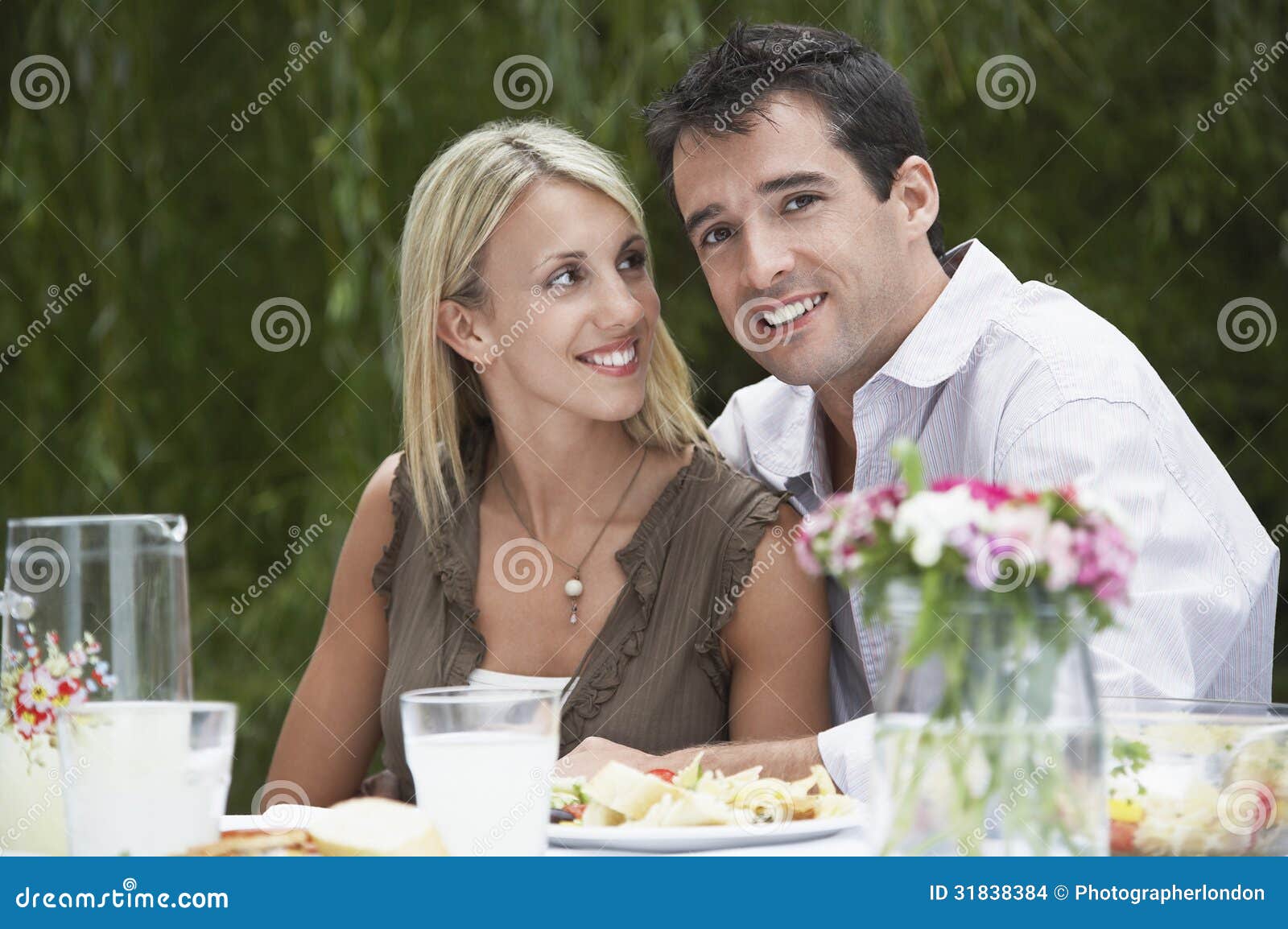 Couple Sitting at Dining Table in Garden Stock Photo - Image of sitting ...