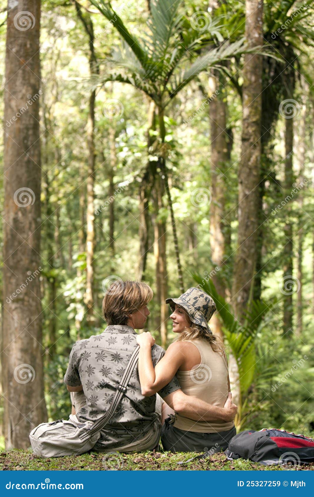 Couple Sitting in Forest stock image. Image of experience - 25327259