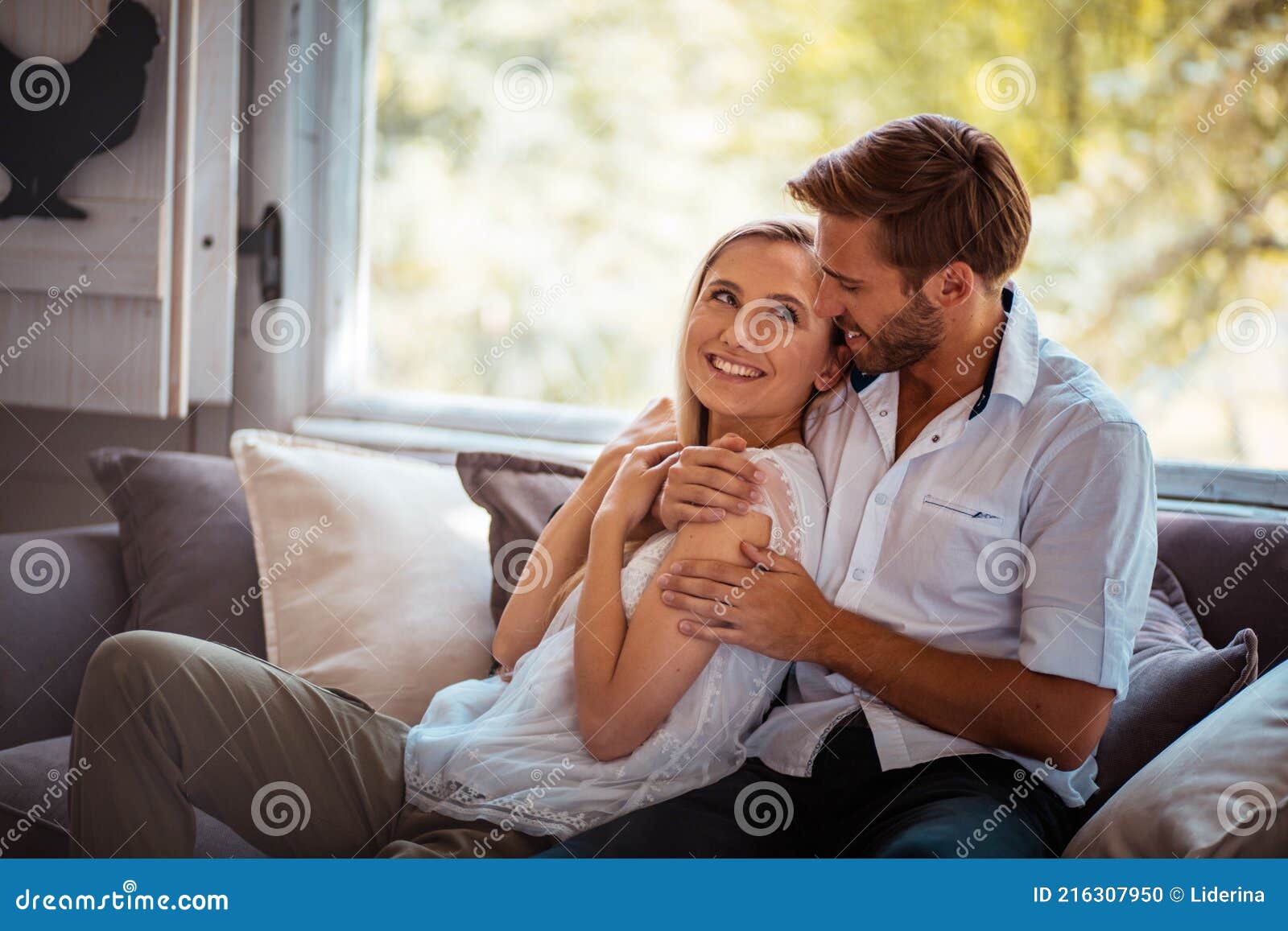 Couple sitting in hug. stock photo. Image of girl, female - 216307950