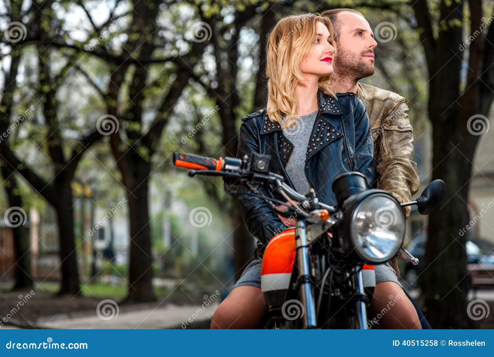 Couple Sitting on the Motorcycle in the City Park Stock Photo - Image ...
