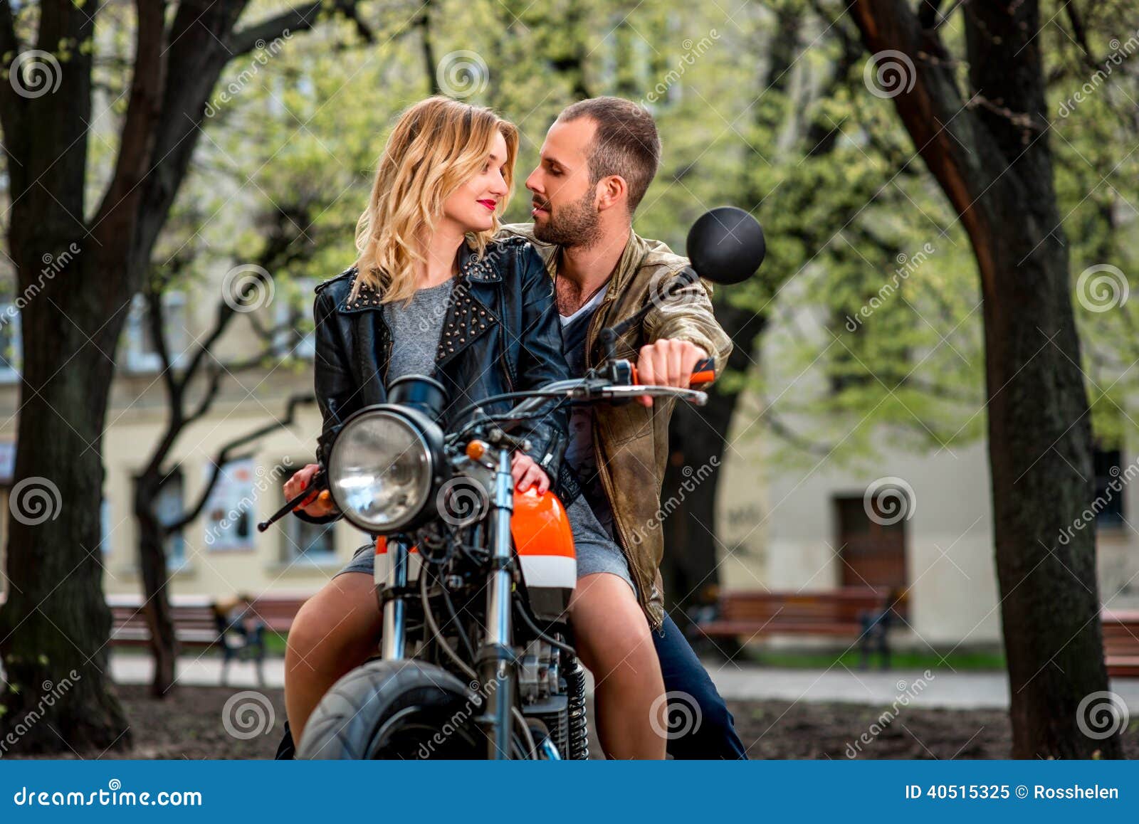 Couple Sitting on the Motorcycle in the City Park Stock Image - Image ...