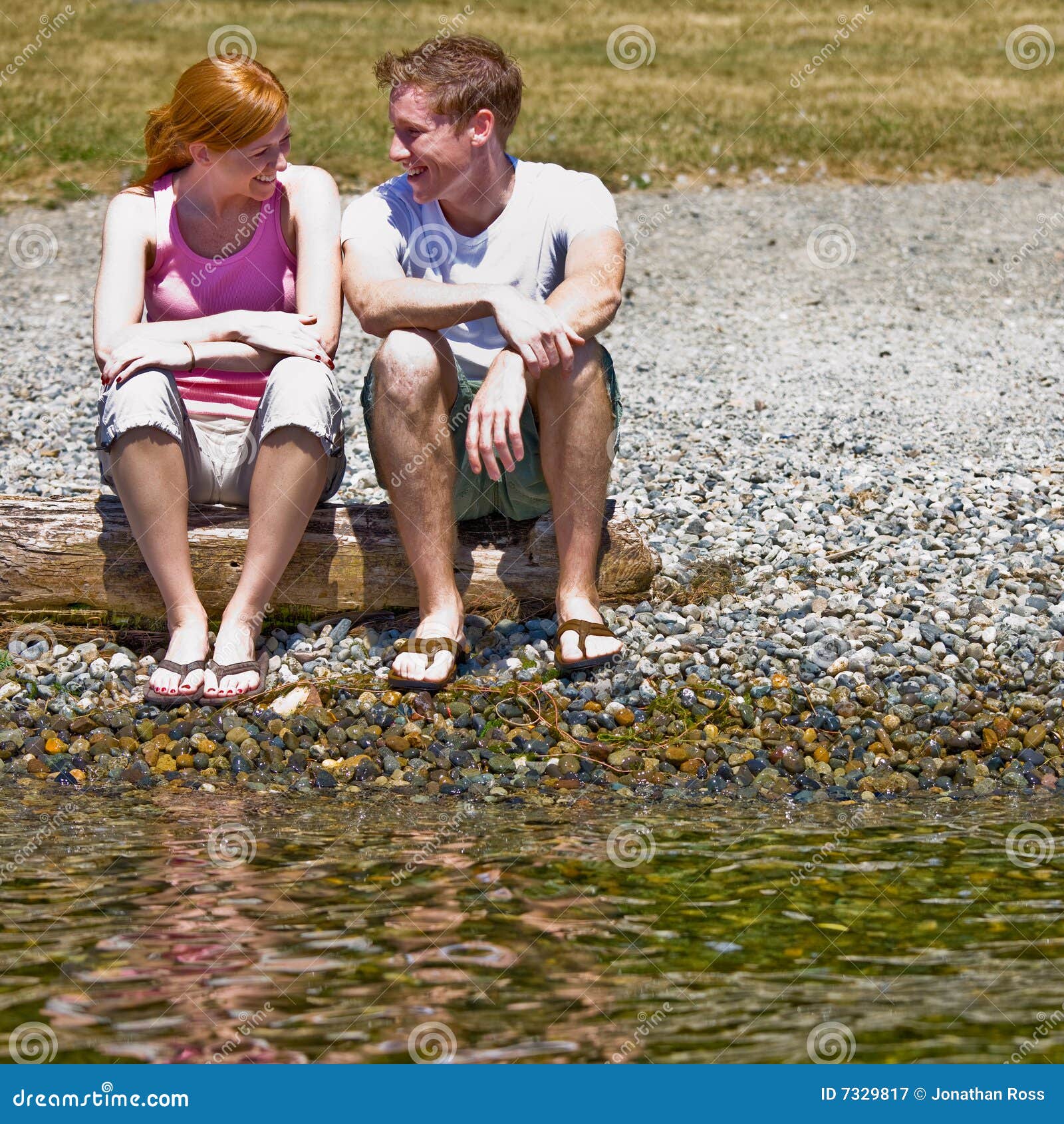 Couple sitting near stream stock image. Image of boyfriend - 7329817