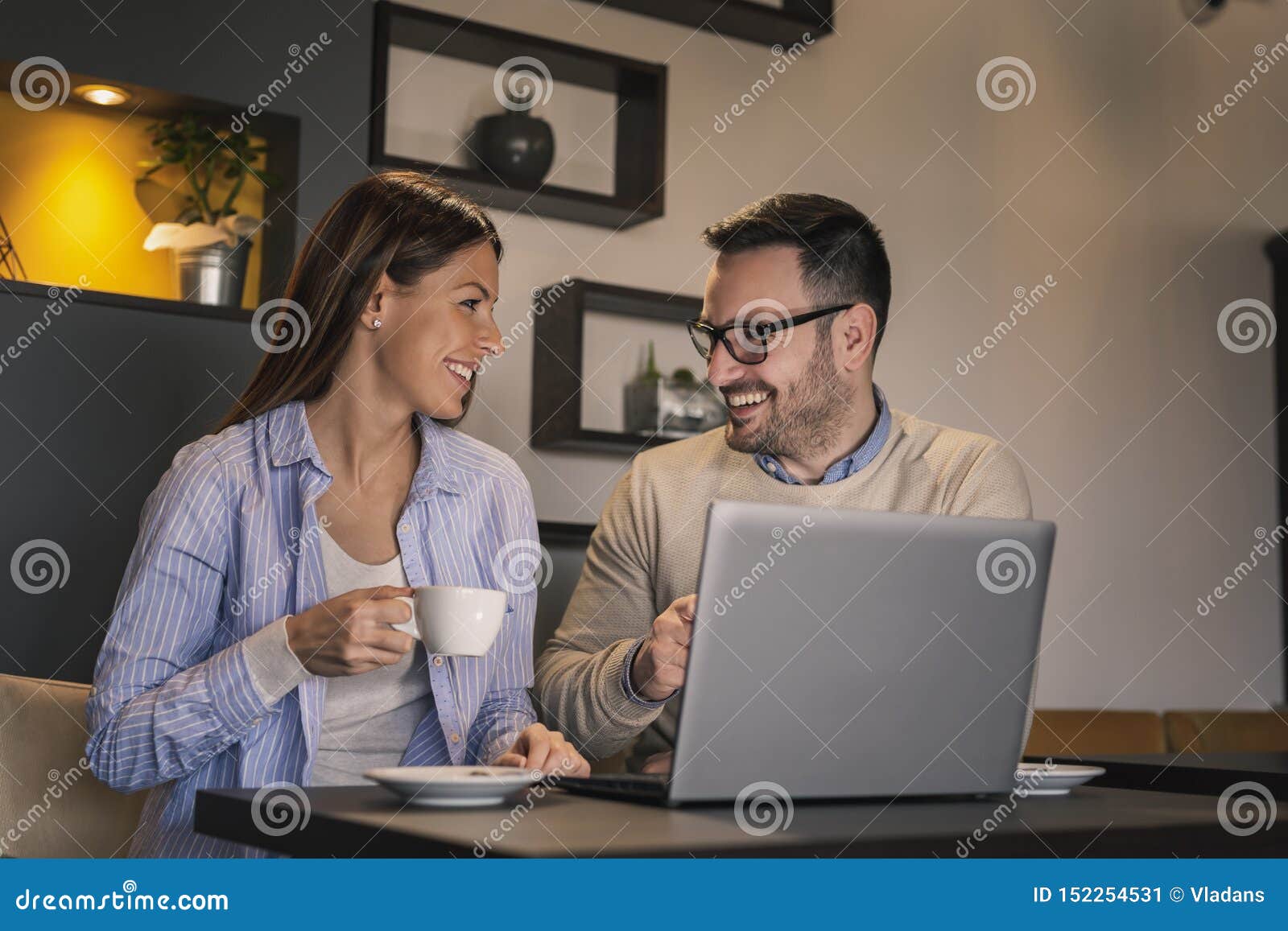 Couple at a Restaurant, Using a Laptop Computer Stock Image - Image of ...