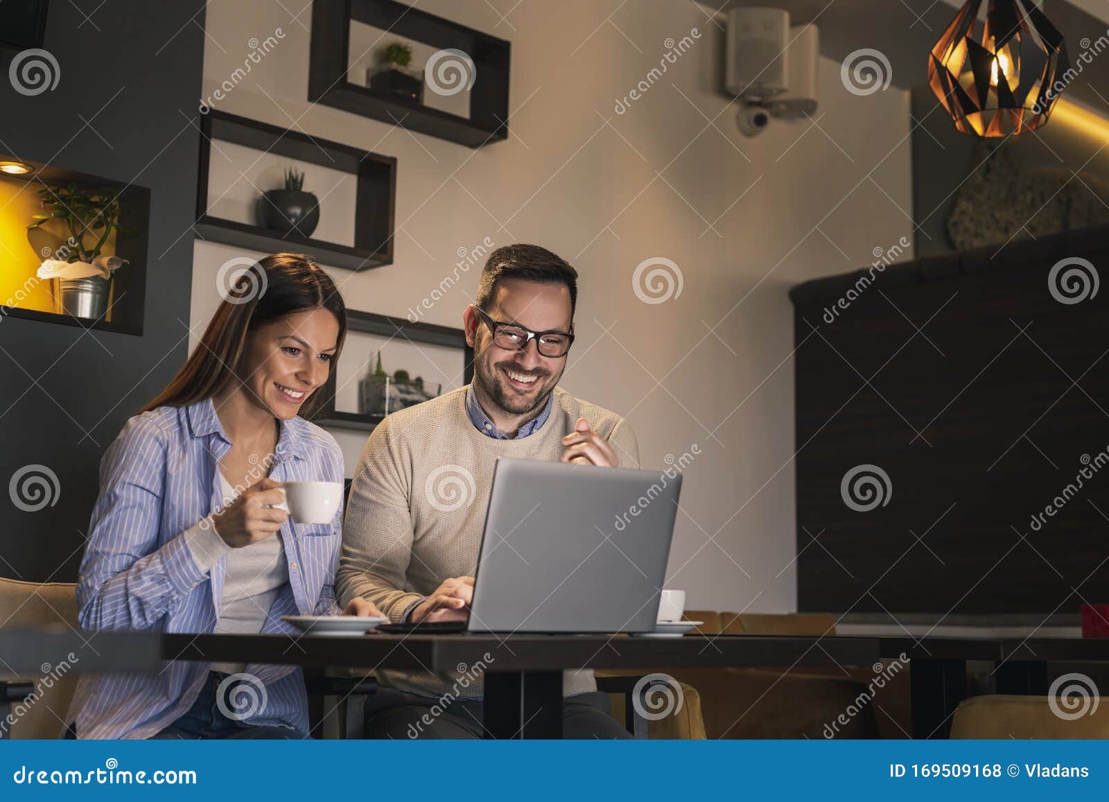 Couple Working on a Laptop Computer Stock Photo - Image of person ...