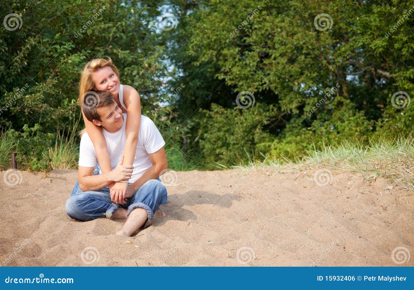 Couple sitting on a sand stock photo. Image of humans - 15932406