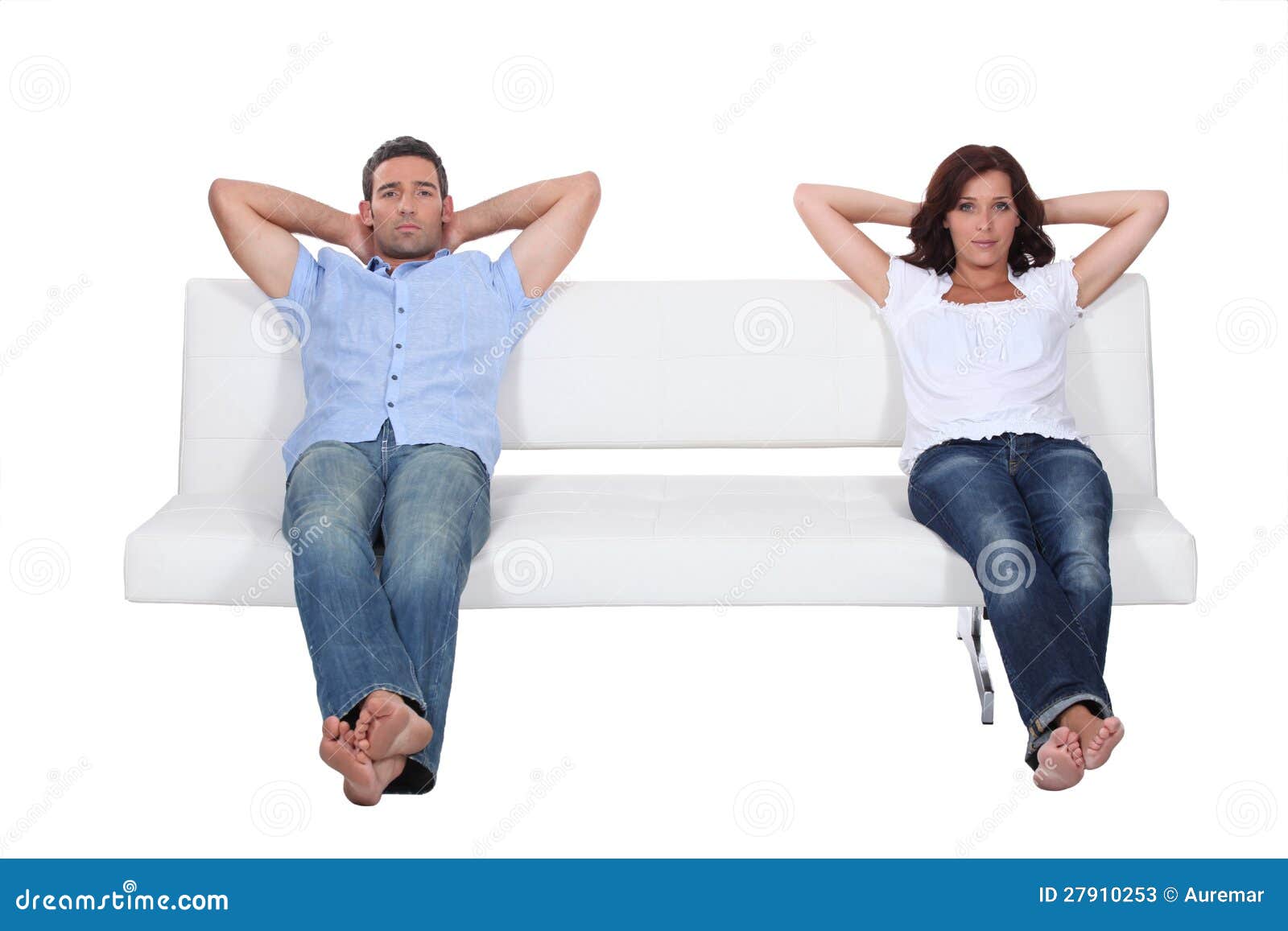 Couple sitting on sofa stock image. Image of posture - 27910253