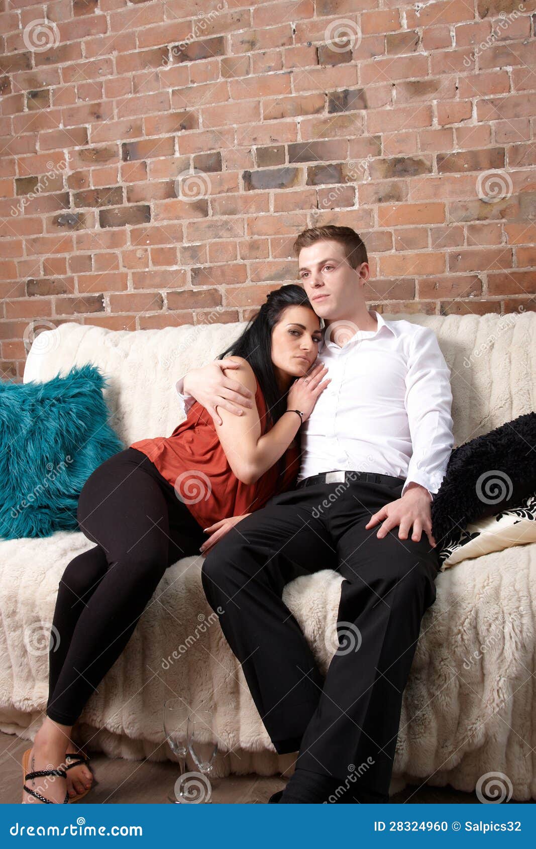 A couple sitting together stock photo. Image of cushions - 28324960