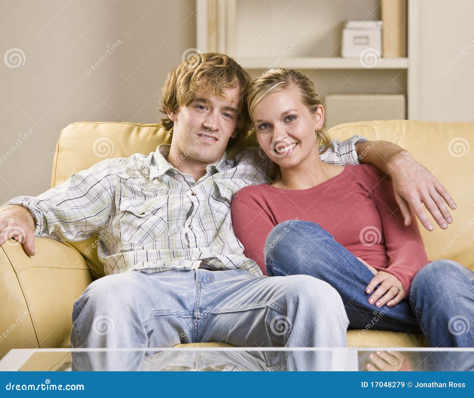 Couple Sitting Together on Sofa Stock Image - Image of person, smile ...