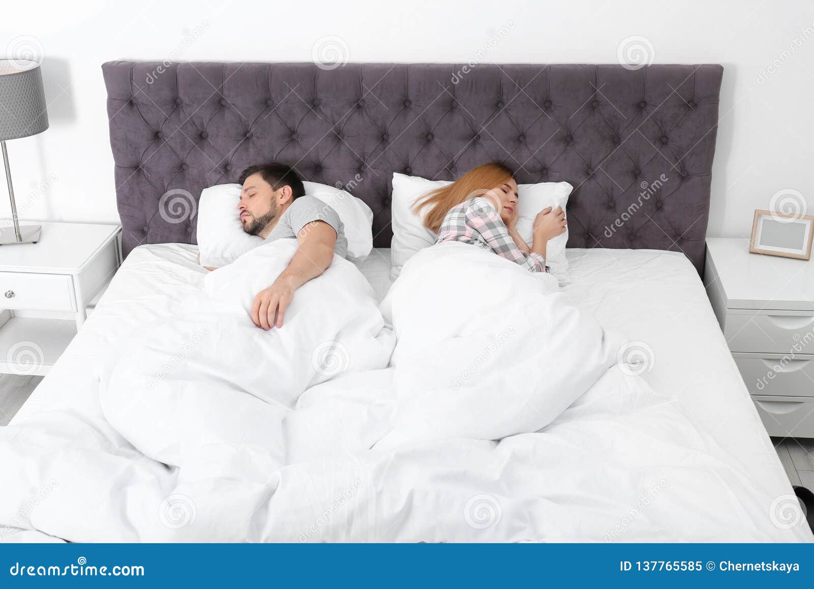 Couple Sleeping Back To Back in Bed at Home. Stock Image - Image of ...