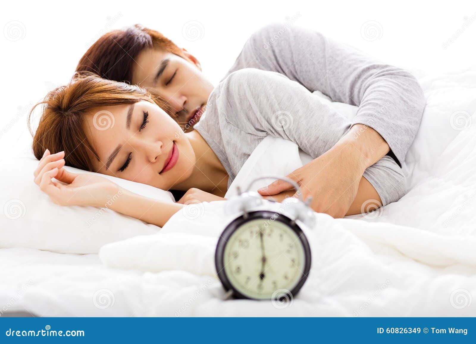 Couple Sleeping in Bed Next To an Alarm Clock Stock Image - Image of ...