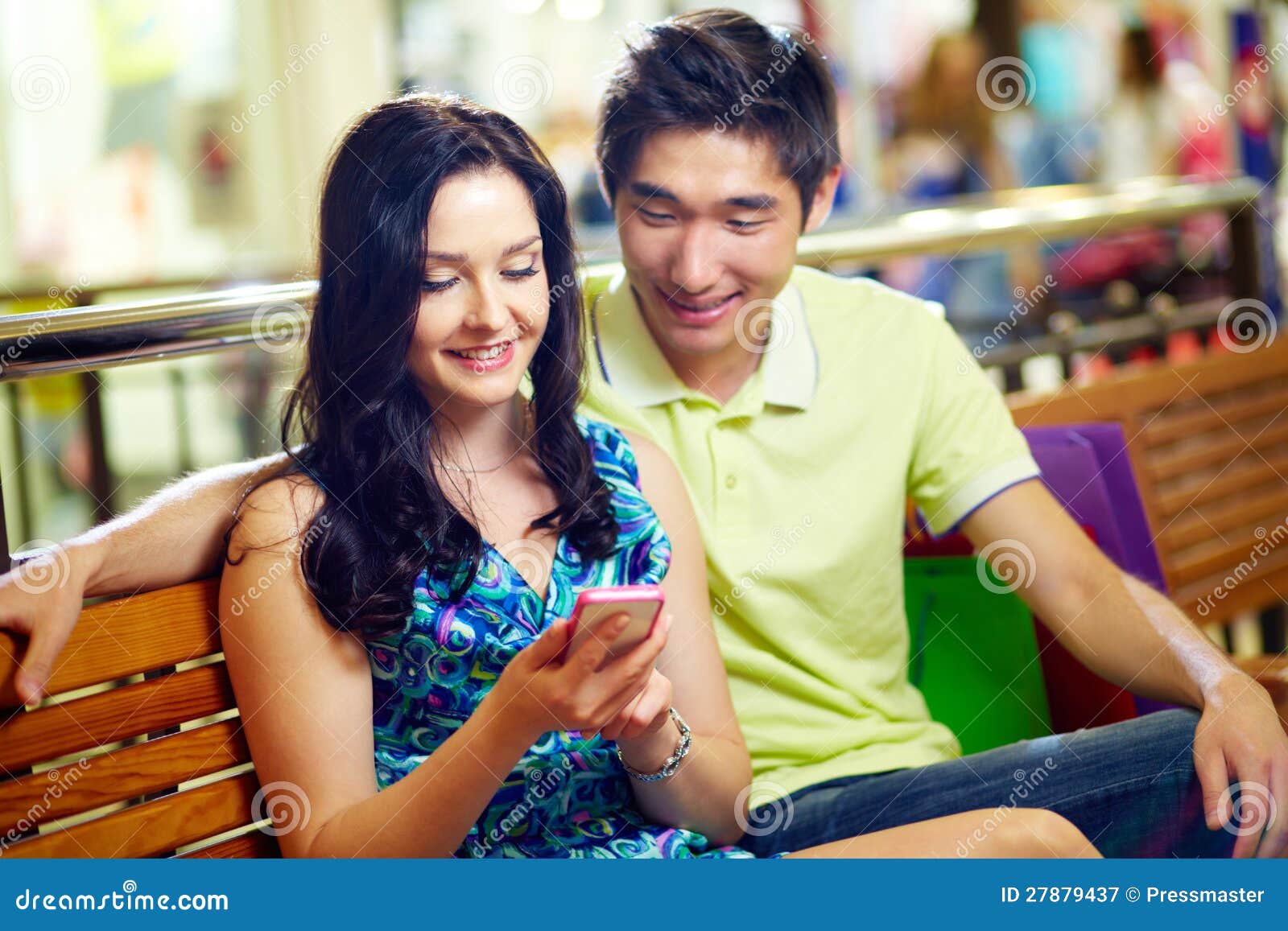 Couple with smart-phone stock image. Image of inside - 27879437
