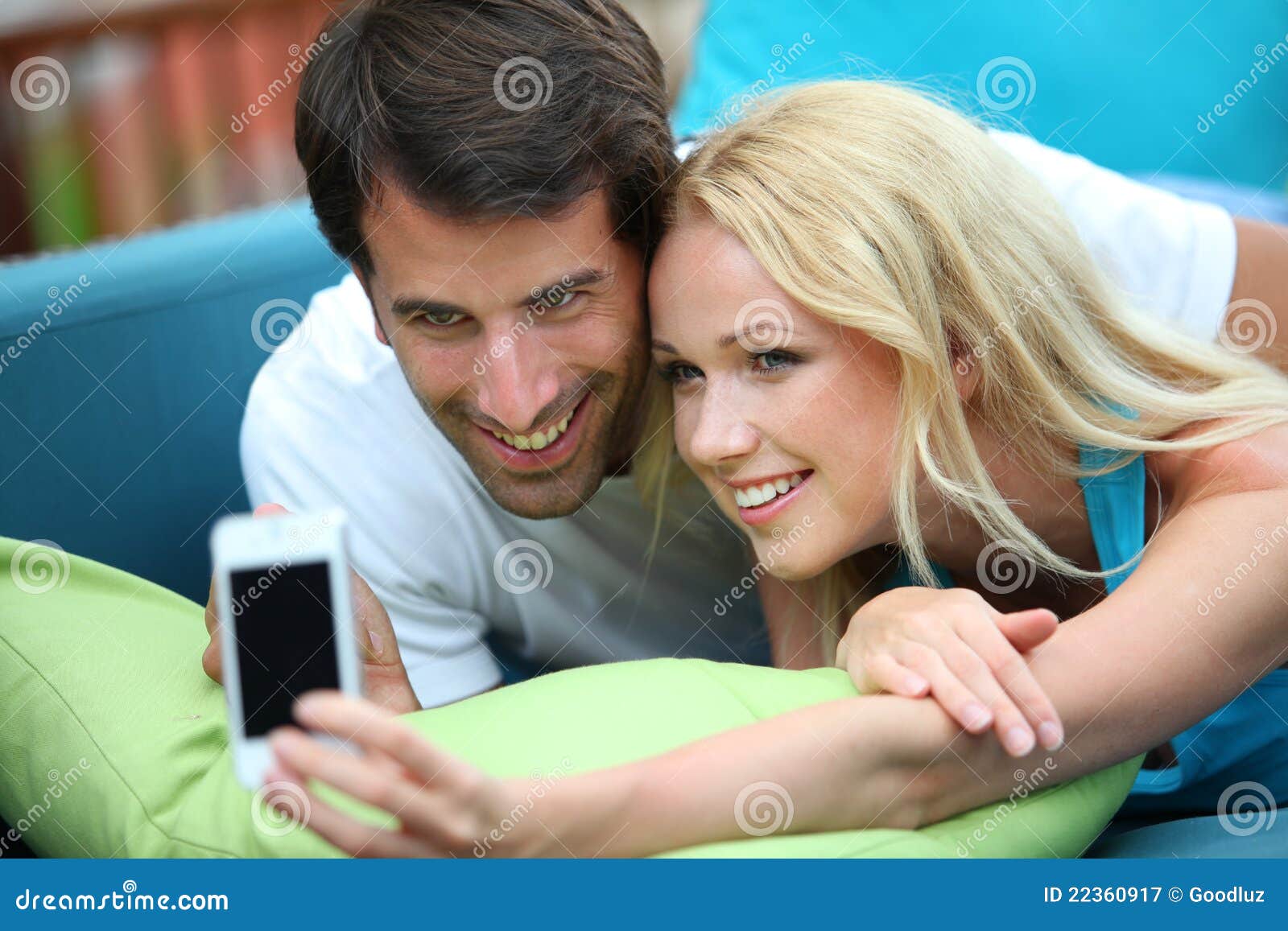 Couple with smartphone stock image. Image of relaxed - 22360917