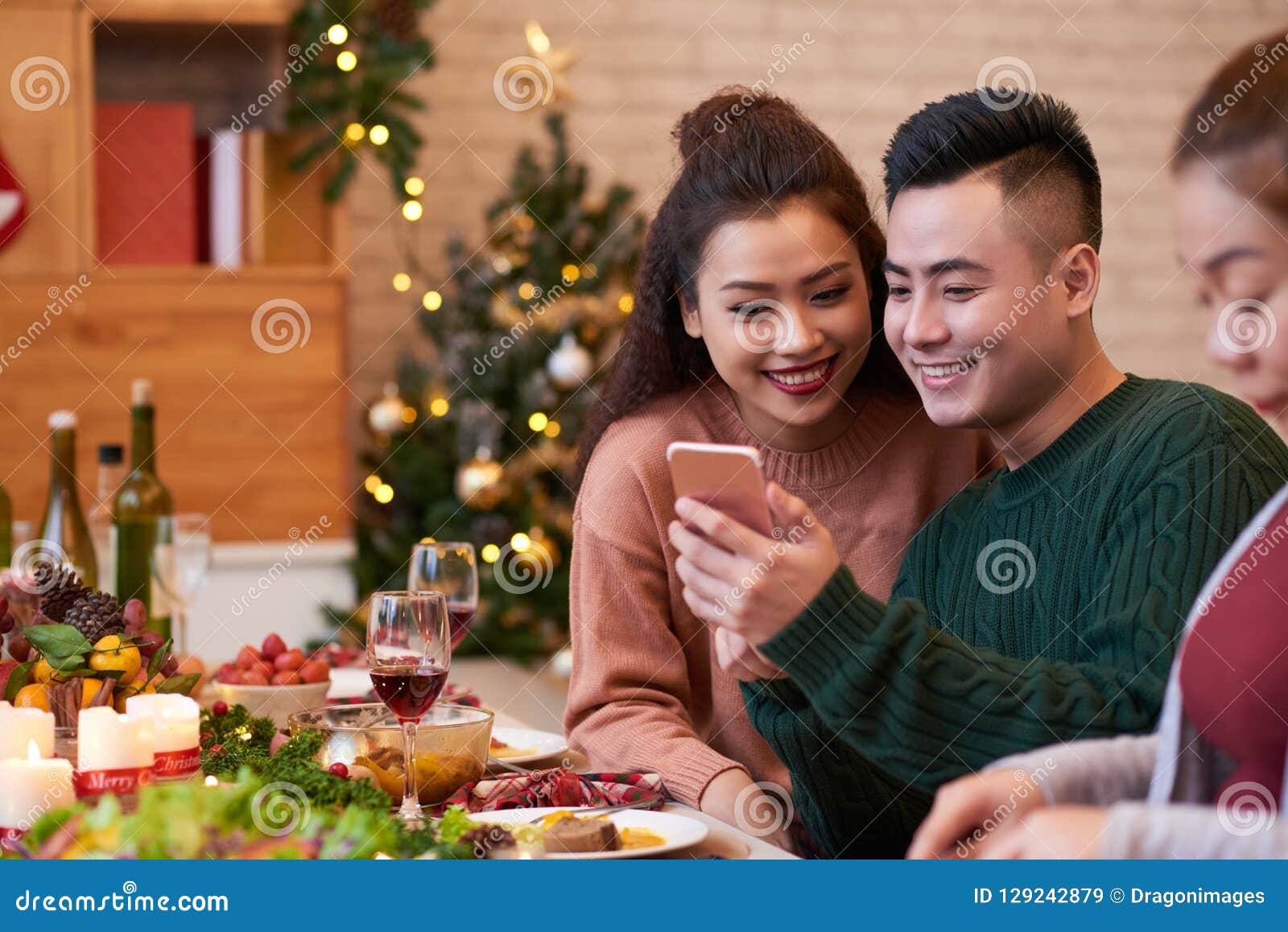 Couple with Smartphone at Dinner Table Stock Image - Image of young ...