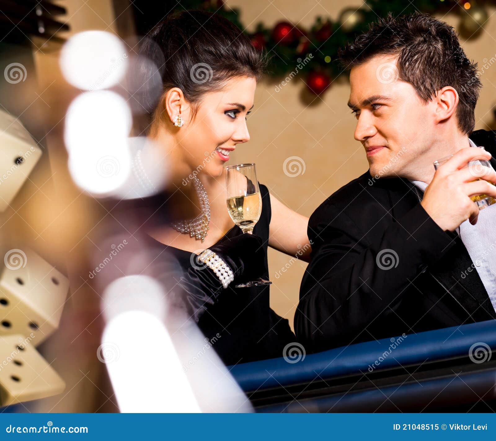 Couple smiling casino stock image. Image of young, beverage - 21048515