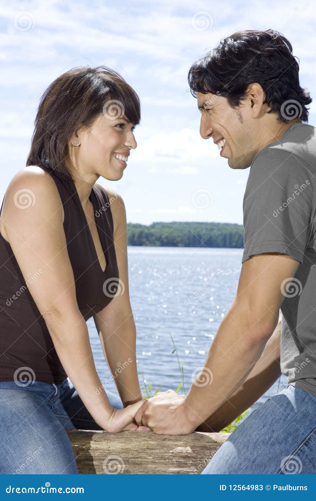 Couple Smiling at Each Other Outdoors Stock Image - Image of latin ...