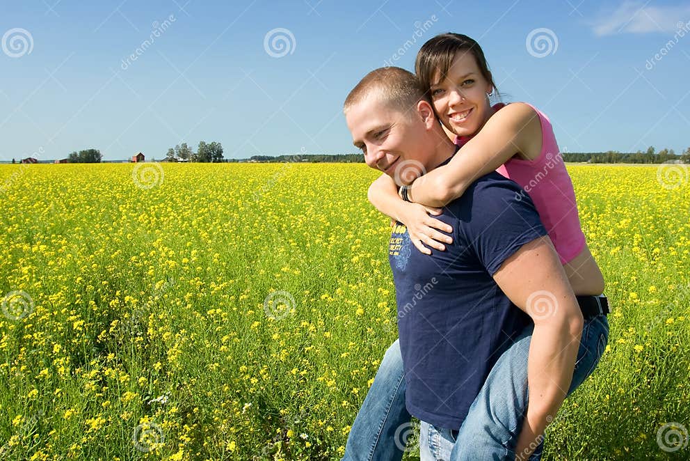 Couple smiling on a field stock image. Image of lovers - 13227717