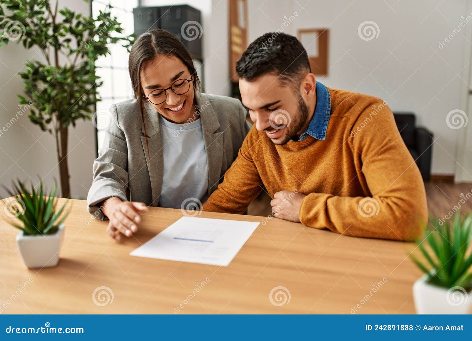 Couple Smiling Happy Reading Document at the Office Stock Photo - Image ...