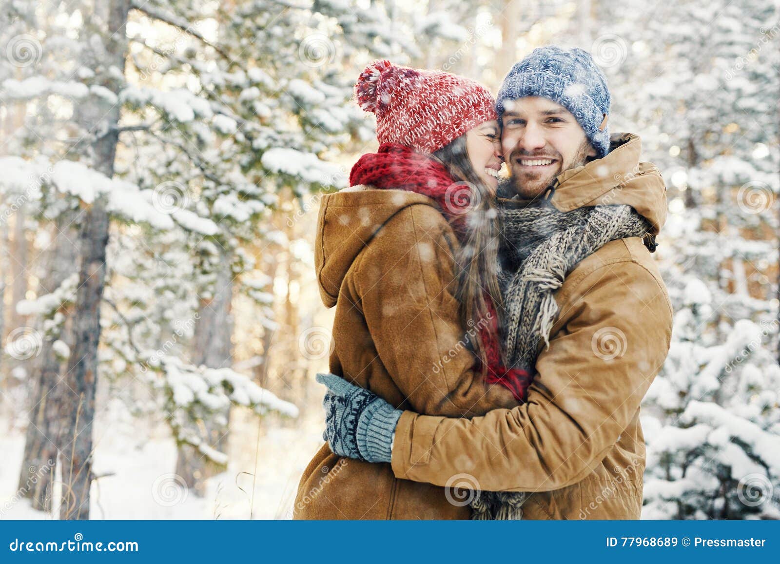 Couple in snowfall stock image. Image of sweethearts - 77968689