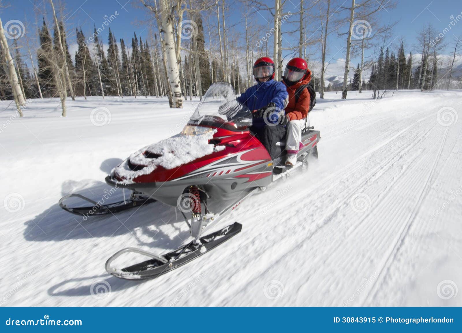 Couple on Snowmobile stock image. Image of horizontal - 30843915