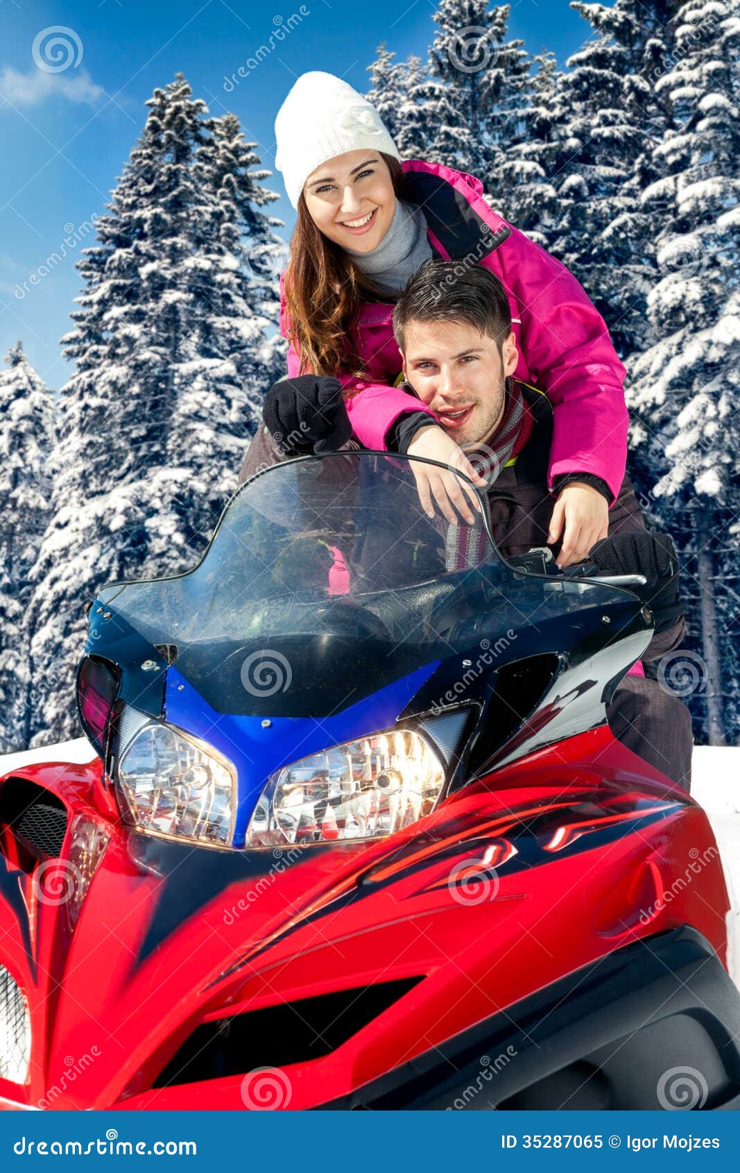 Couple on snowmobile stock image. Image of driving, beautiful - 35287065