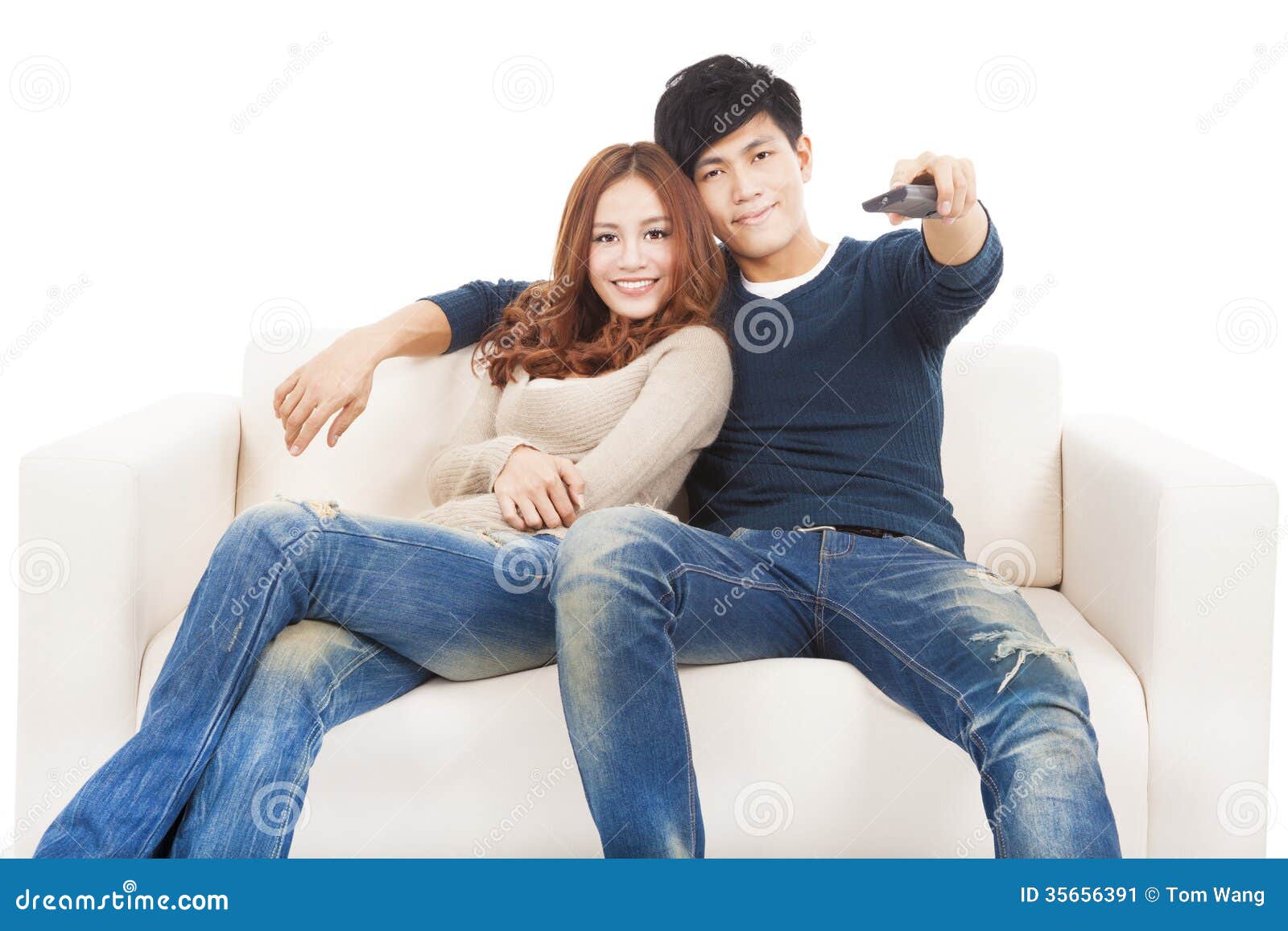 Couple on Sofa Watching TV with Remote Control Stock Image - Image of ...