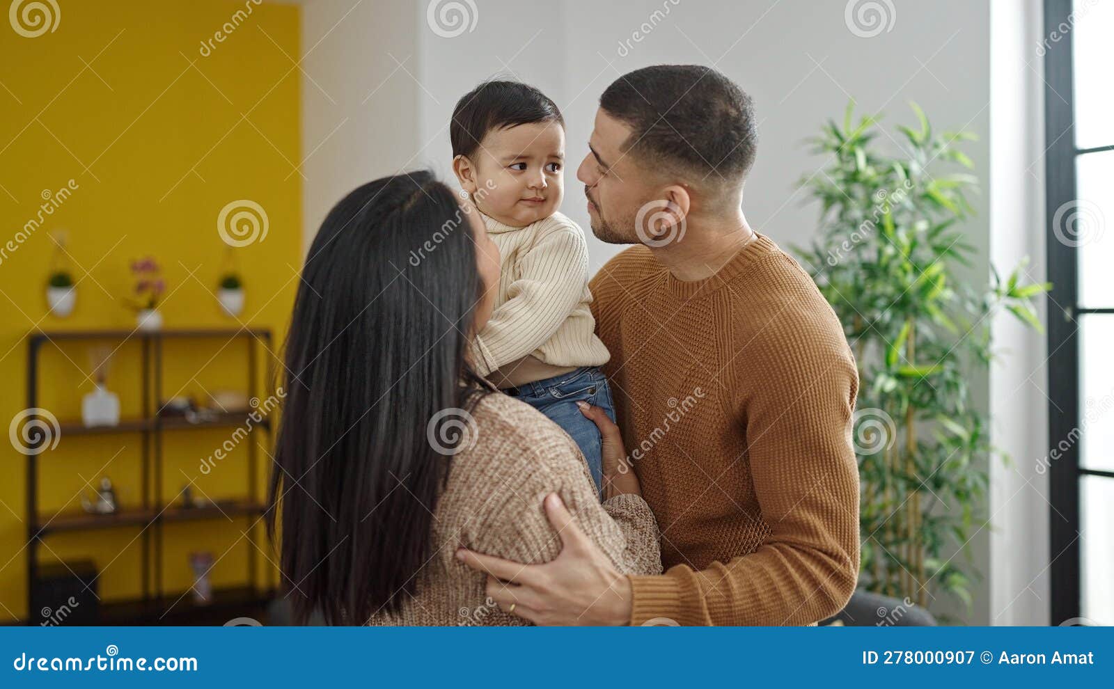 Couple and Son Hugging Each Other Standing at Home Stock Image - Image ...