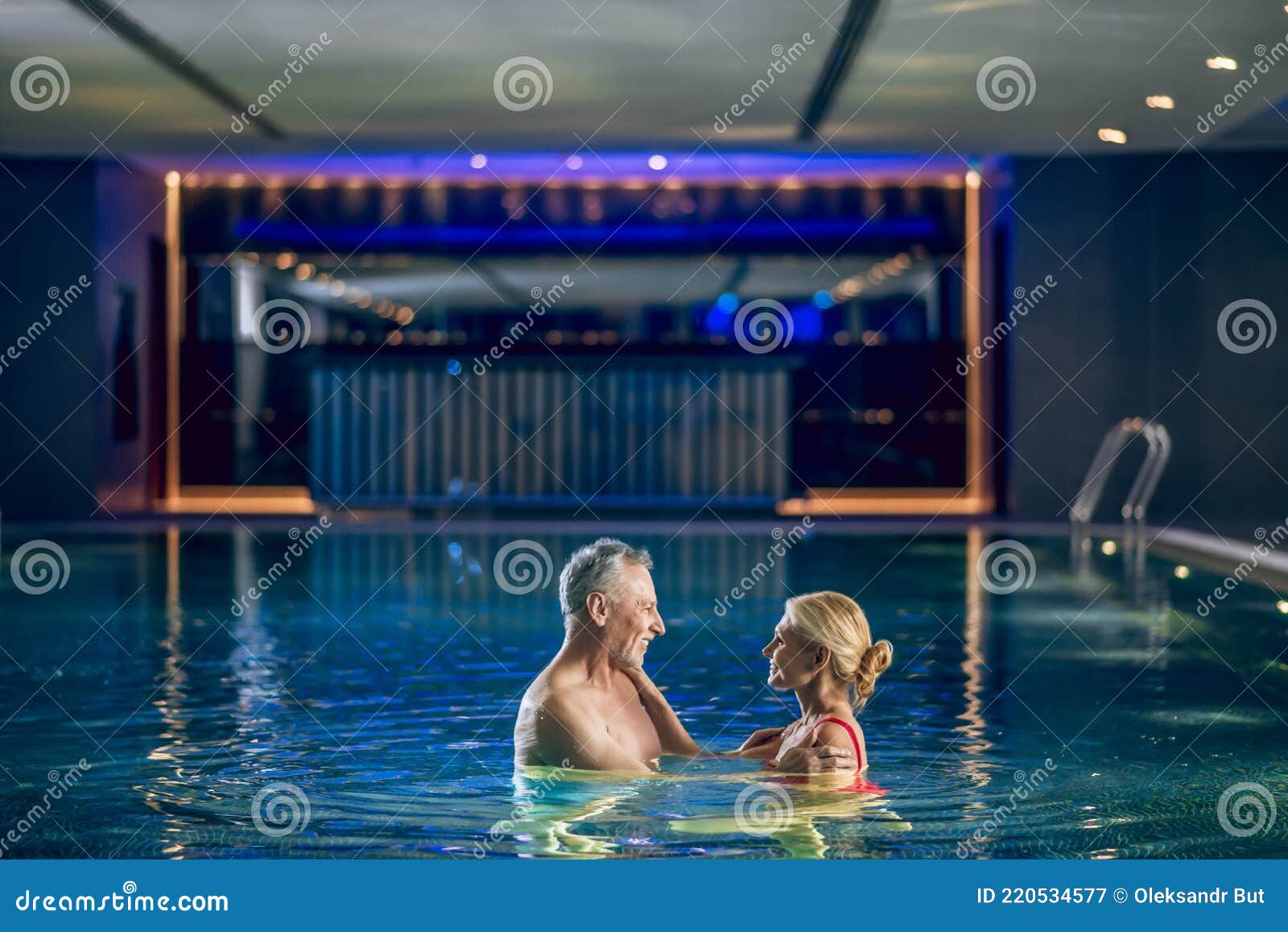 Couple Spending Time in a Swimming Pool and Looking Romantic Stock ...