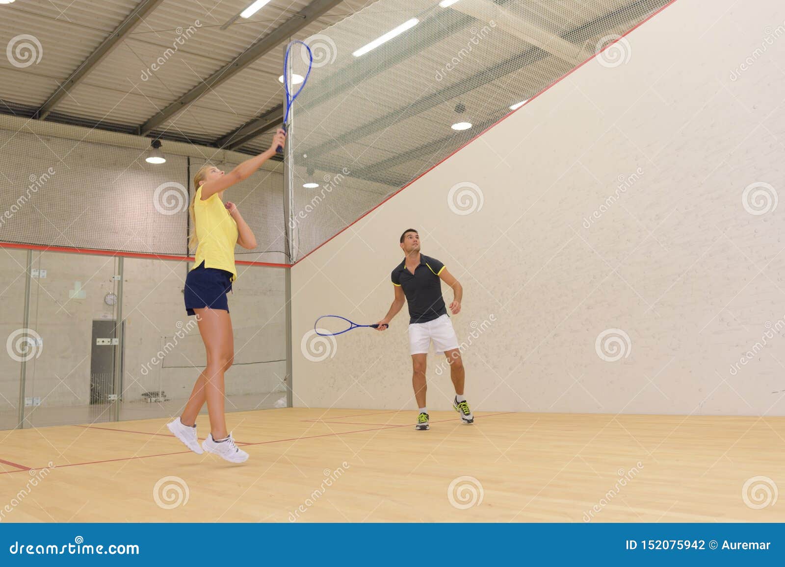 Couple with Squash Rackets Playing Indoor Stock Photo - Image of squash ...