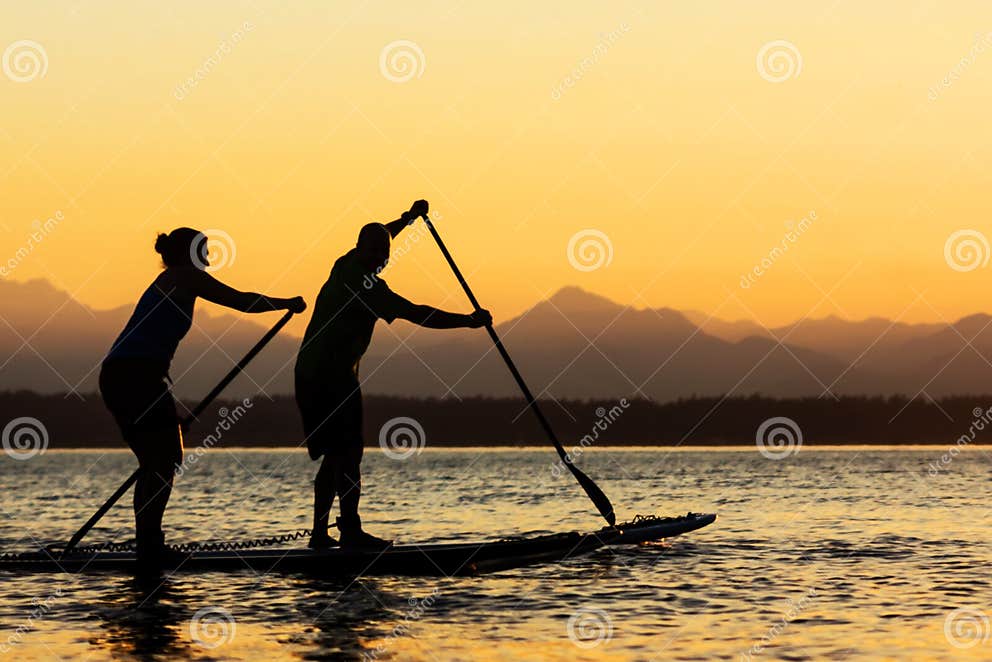 Couple on Stand Up Paddle Boards Stock Photo - Image of stand, lake ...