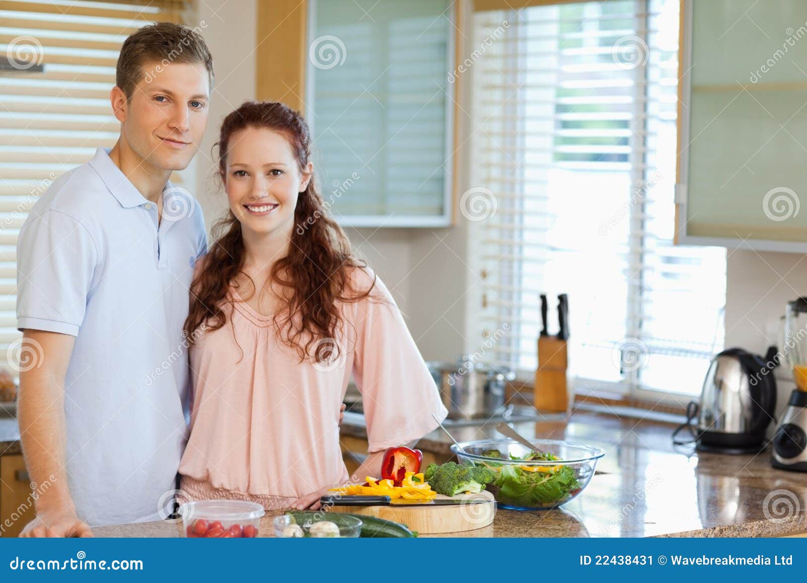 Couple Standing Behind Kitchen Counter Stock Image - Image of cheerful ...
