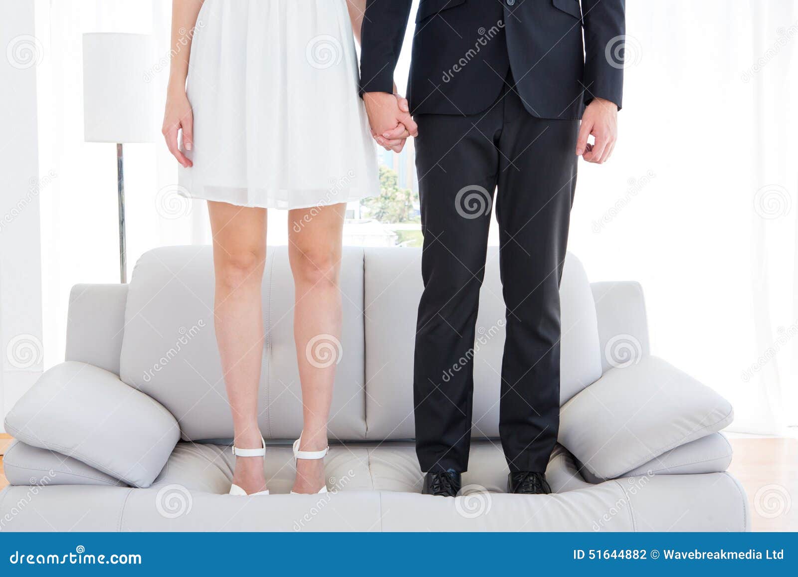 Couple Standing on the Couch Stock Photo - Image of people, caucasian ...
