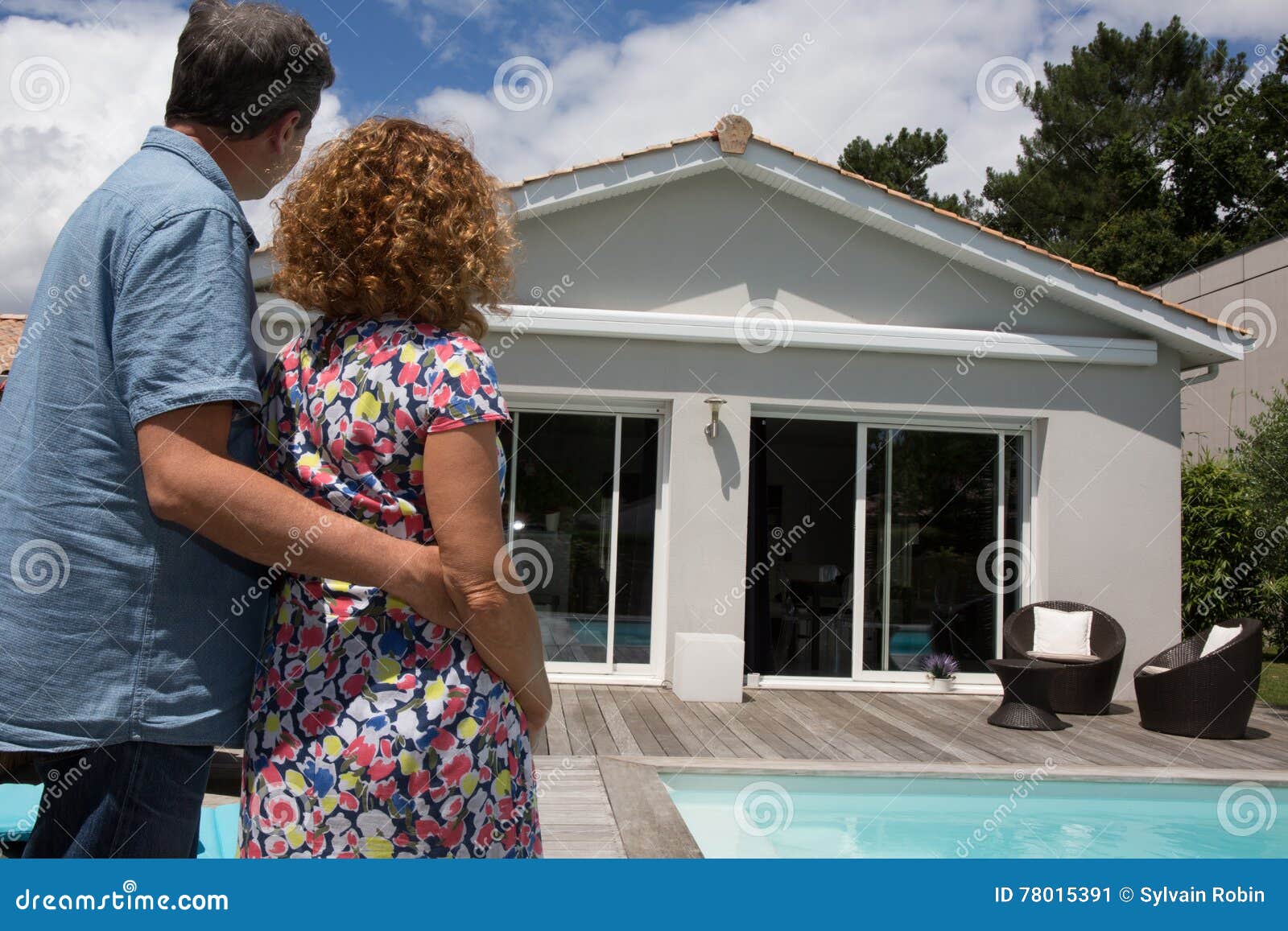 Couple Standing in Front of Newly Owned House Stock Image - Image of ...