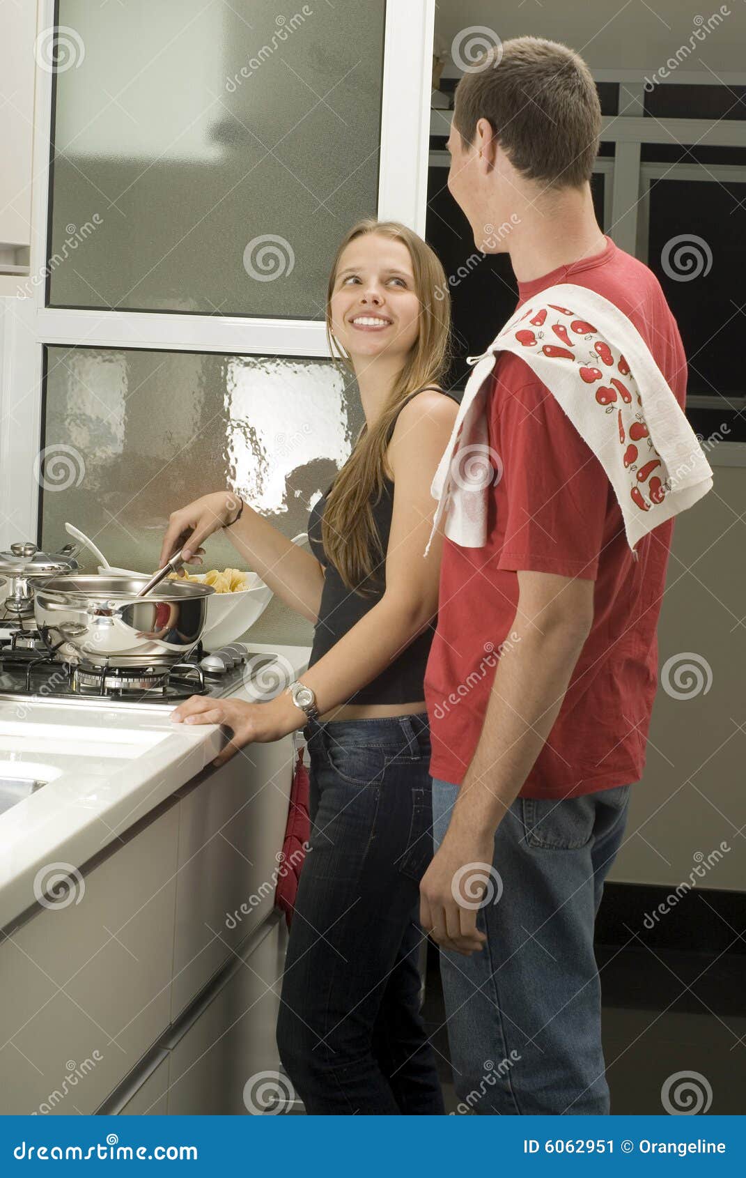 Couple Standing in Kitchen Cooking - Vertical Stock Image - Image of ...