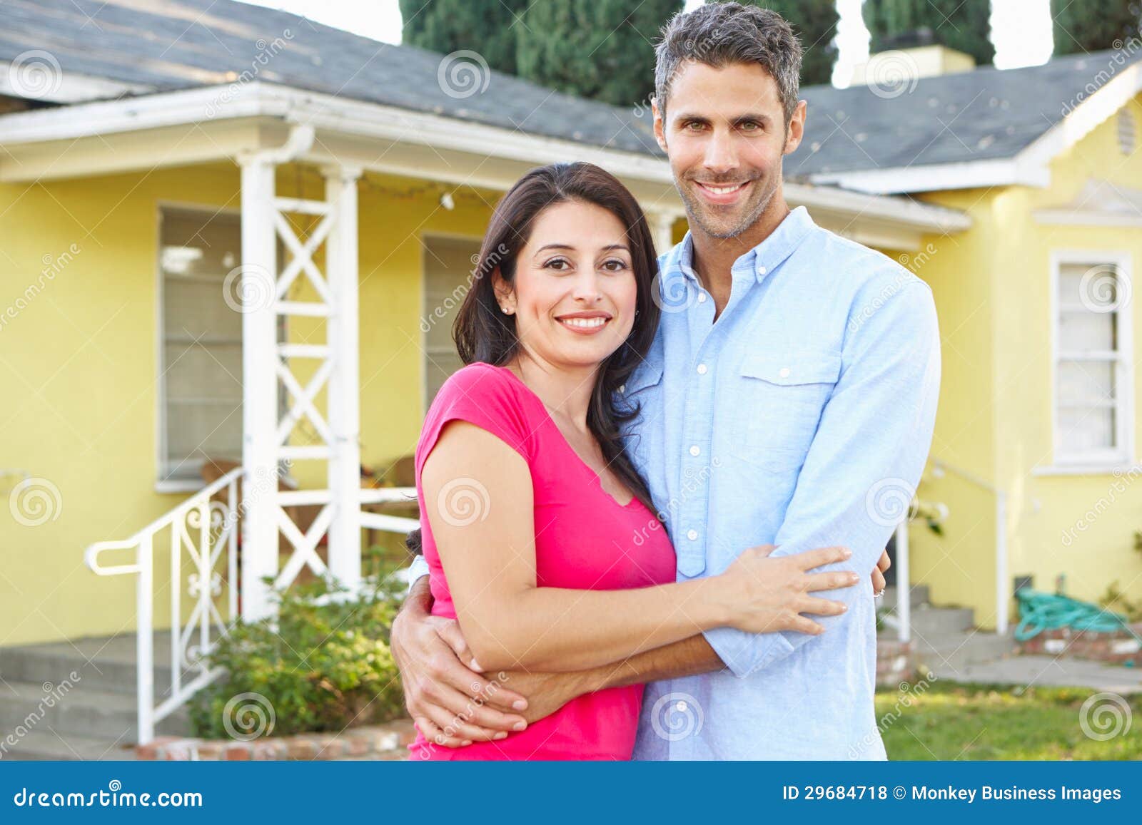 Couple Standing Outside Suburban Home Stock Photo - Image of house ...