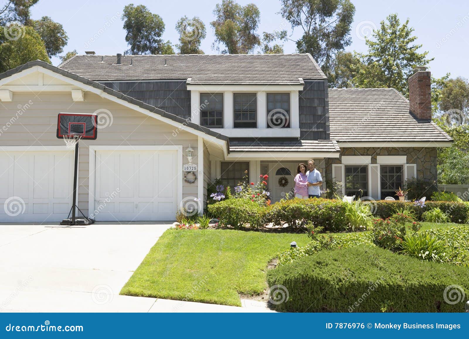 Couple Standing Outside Their House Stock Photo - Image of looking ...