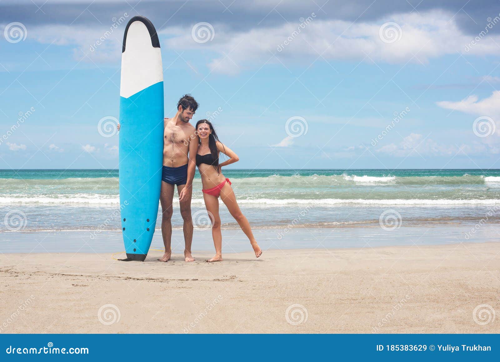 Couple Standing With Surfboards At The Beach Stock Image Stock Image