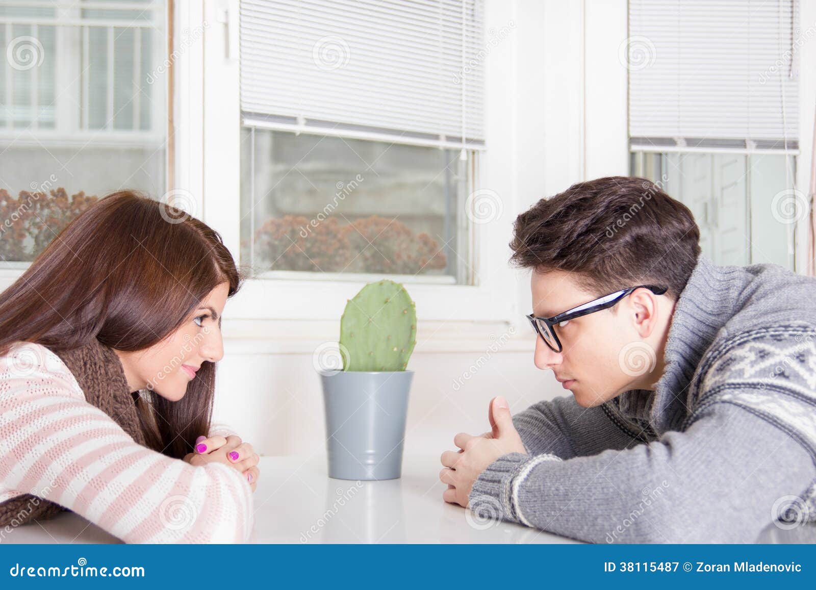 Couple Staring at Each Other Across the Table Stock Image - Image of ...