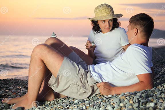 Couple in Straw Hat Design Pyramids from Pebble Stock Image - Image of ...