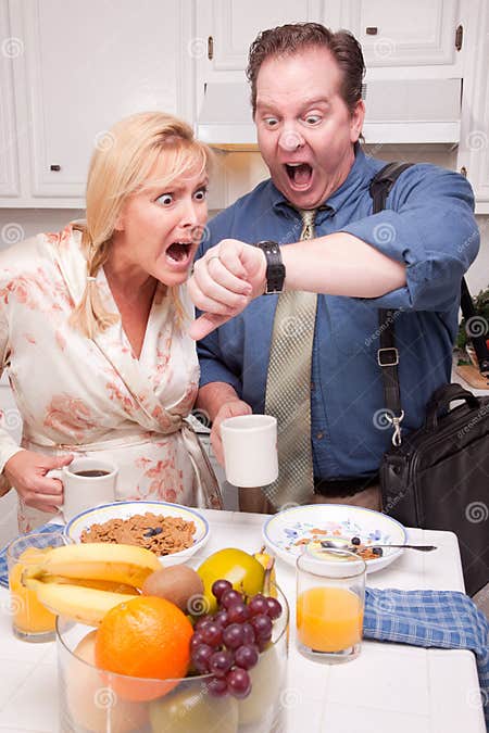 Couple Stressed Out in Kitchen Late for Work Stock Photo - Image of ...