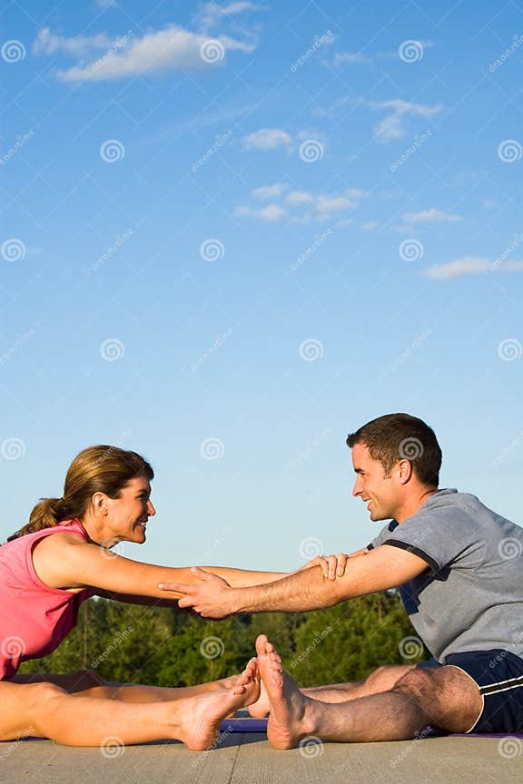 Couple Stretching Groin - Vertical Stock Photo - Image of calm, outside ...