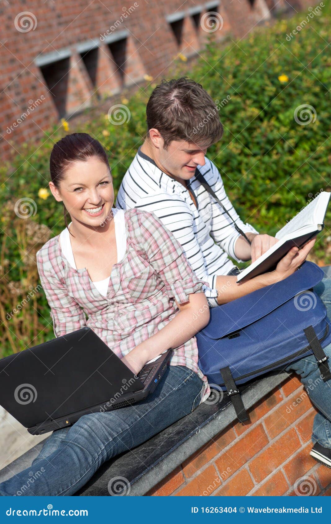 Couple of Students Working with Book and Laptop Stock Photo - Image of ...
