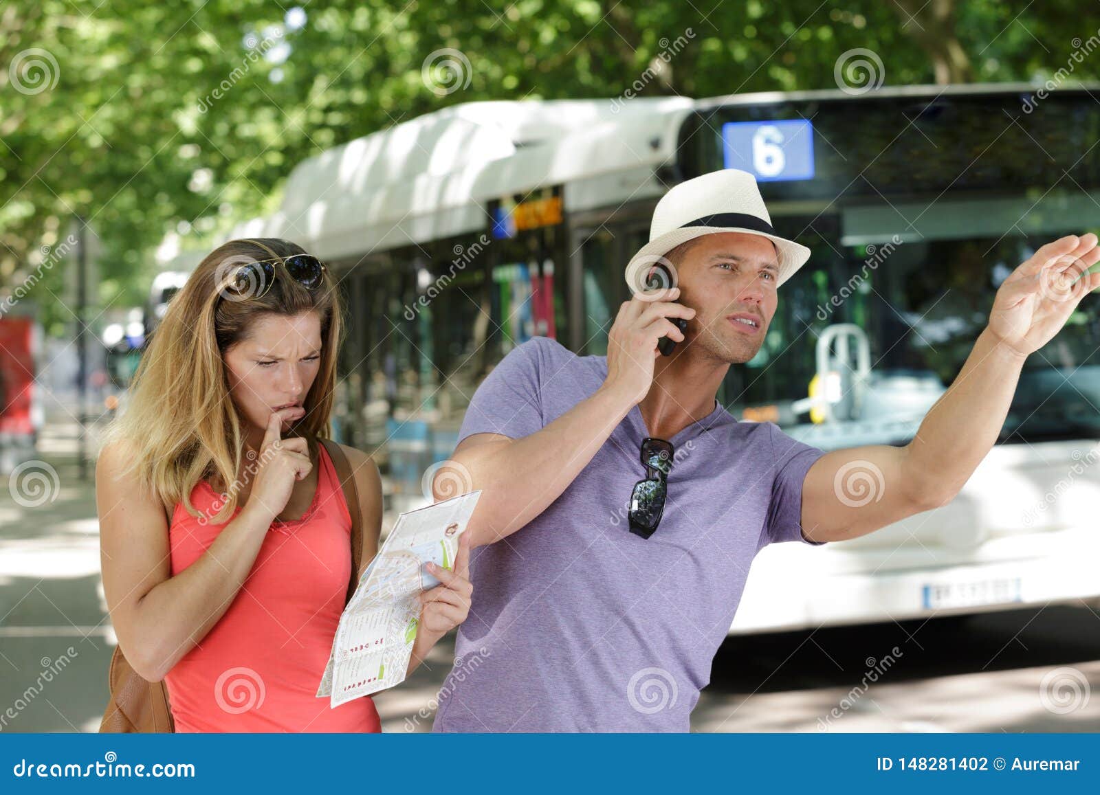 Couple in Suburbs Holding Map and Hailing Bus Stock Photo - Image of ...