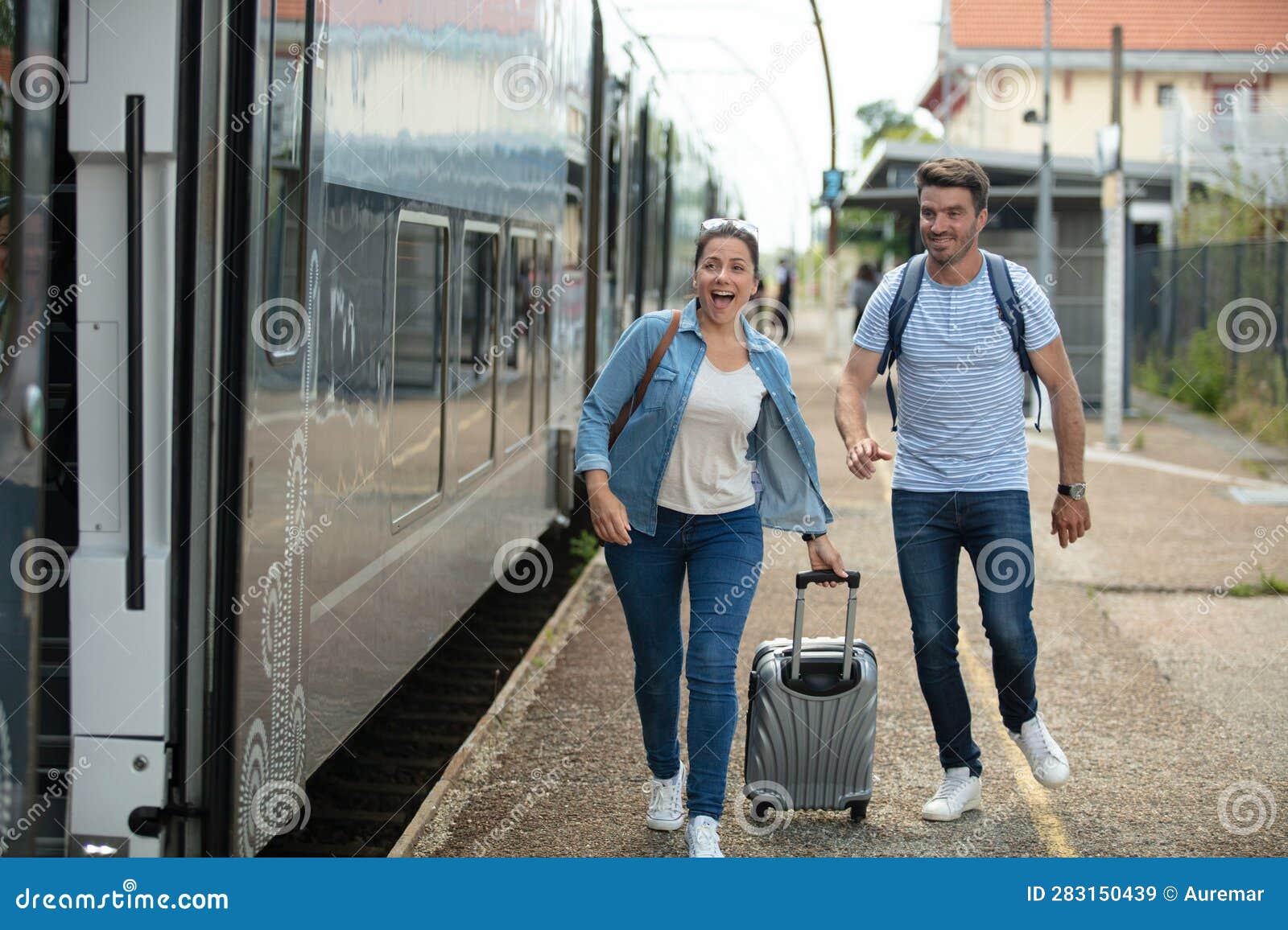 Couple with Suitcase Running To Get on Train Stock Image - Image of ...
