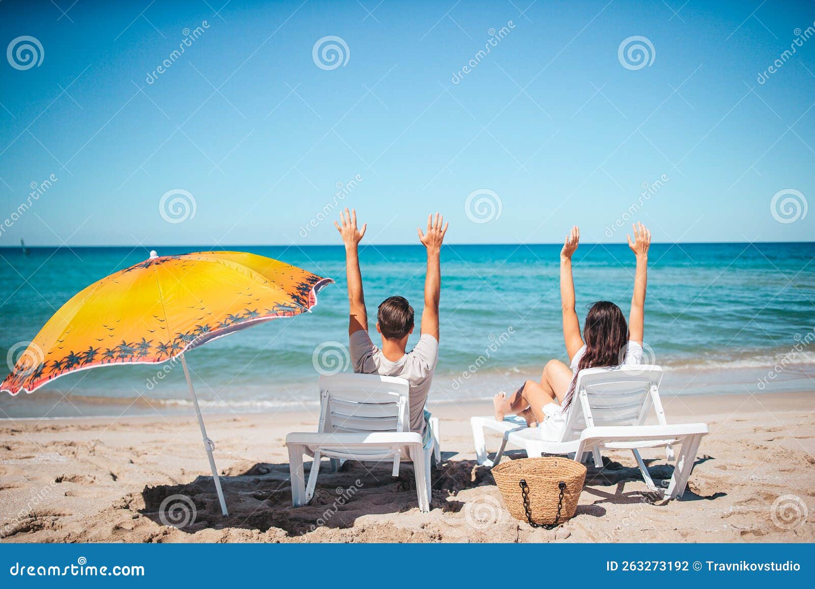 Couple in Sun Beds on a Tropical Beach Relax and Have Fun Stock Photo ...