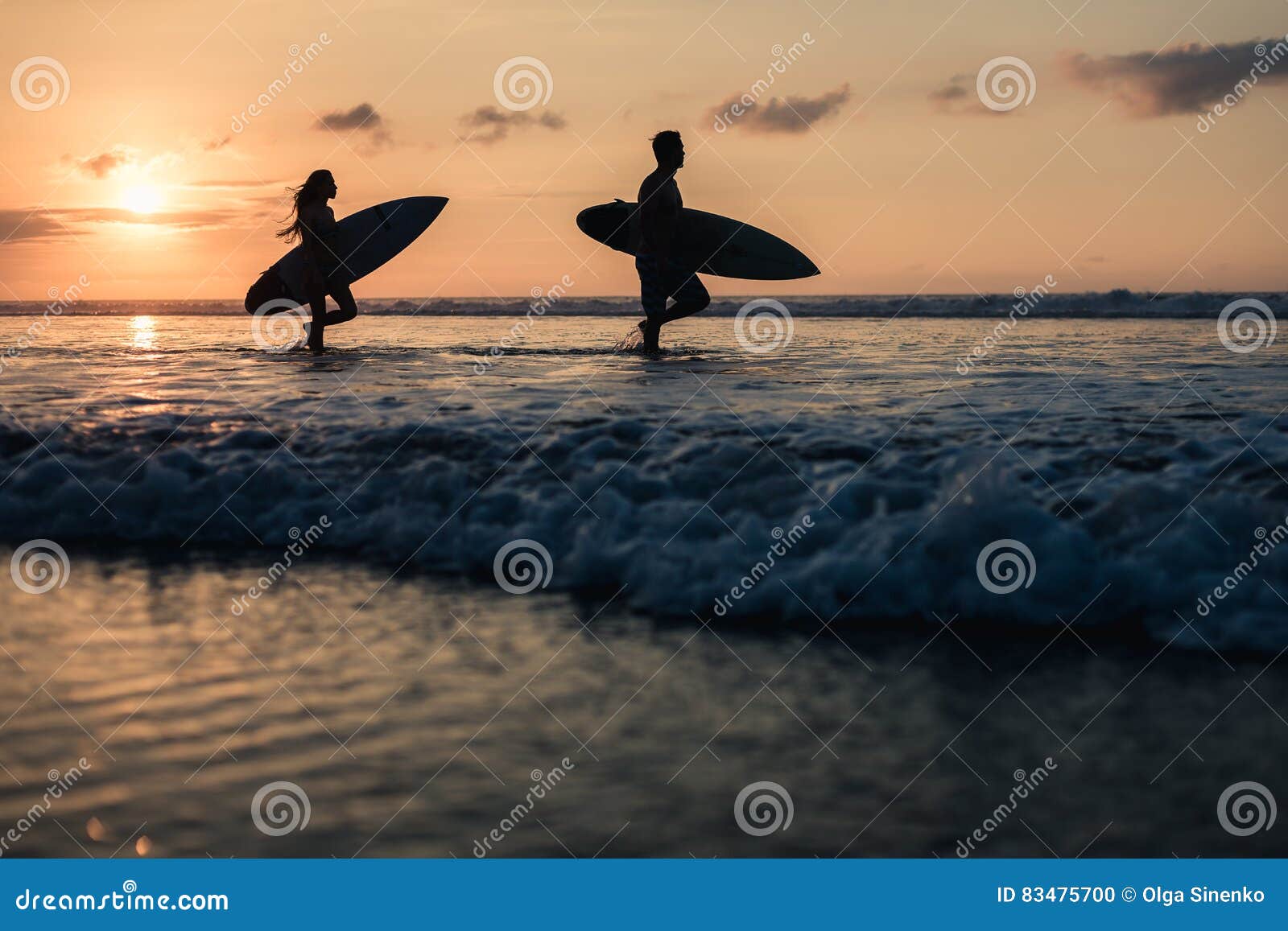 Couple Of Surfers Walking On Coast In Indonesia Royalty Free Stock