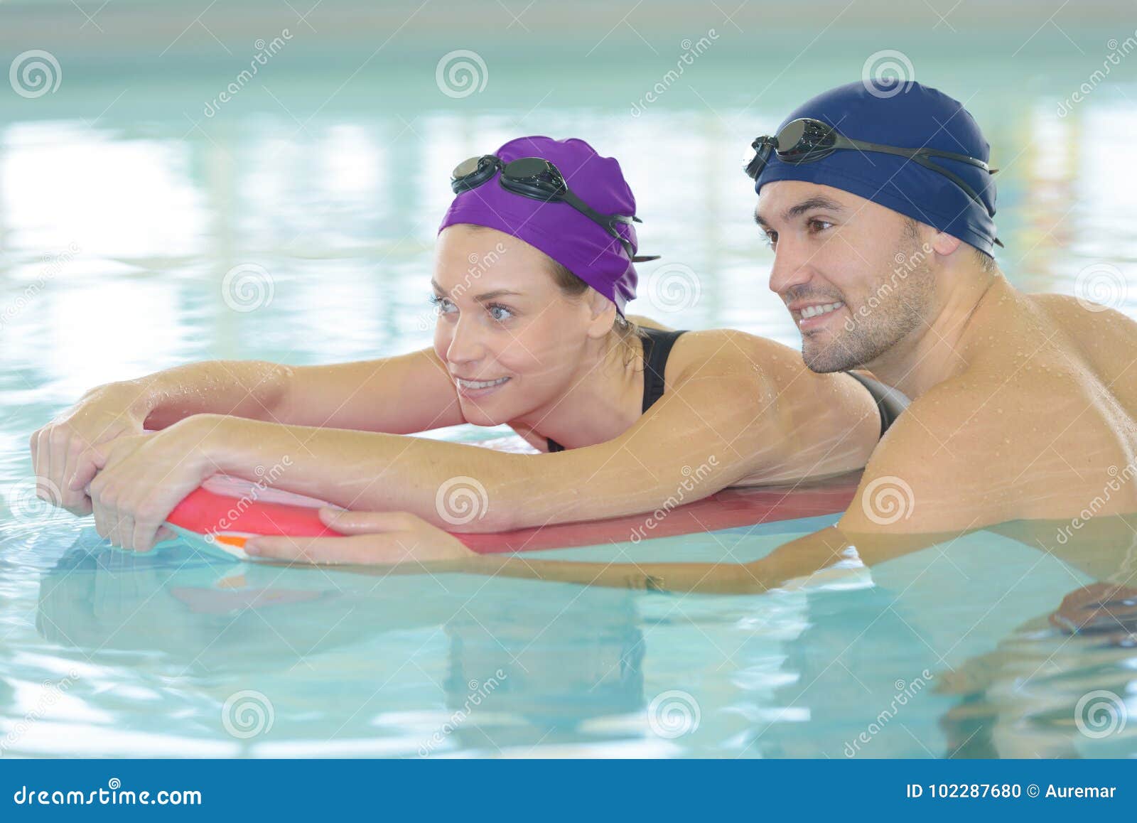 Couple swimming in pool stock photo. Image of couple - 102287680