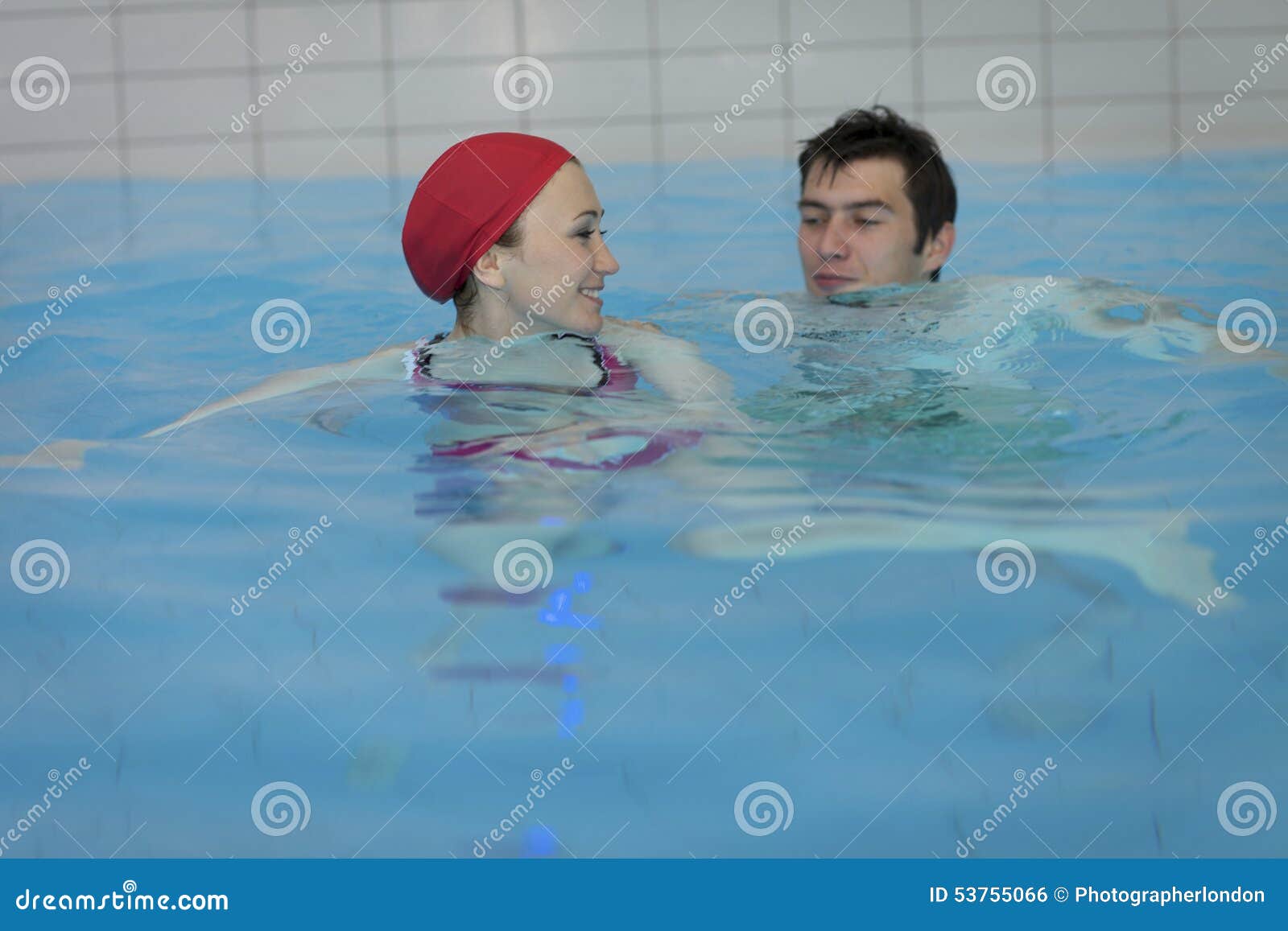 Couple in swimming pool stock photo. Image of summer - 53755066